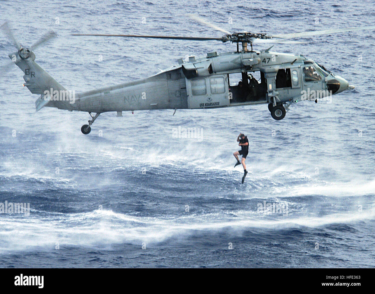 An air crew member from Helicopter Combat Support Squadron Eight aboard ...