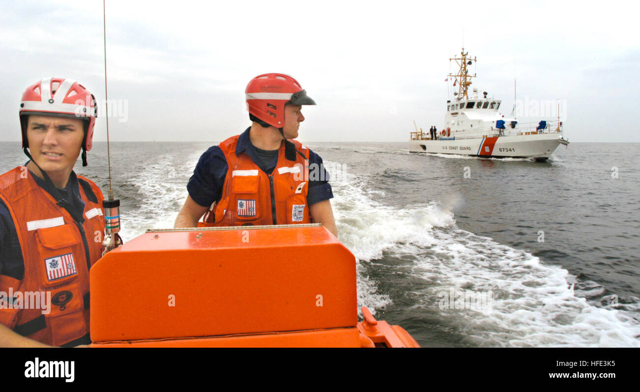 Sailors operate alongside Coast Guard Cutter Bonito (WPB-87341) in RHIB ...