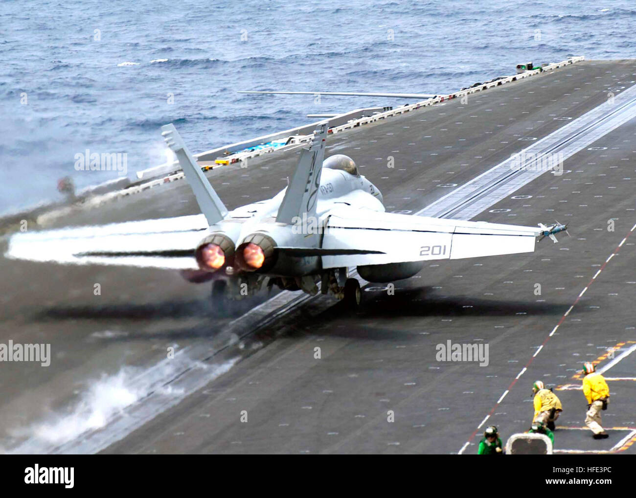 An F/A-18C Hornet launches via catapult from USS Abraham Lincoln (CVN ...