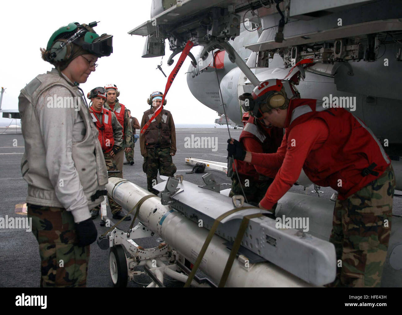 Aviation ordnancemen from Electronic Attack Squadron VAQ-131 load inert ...