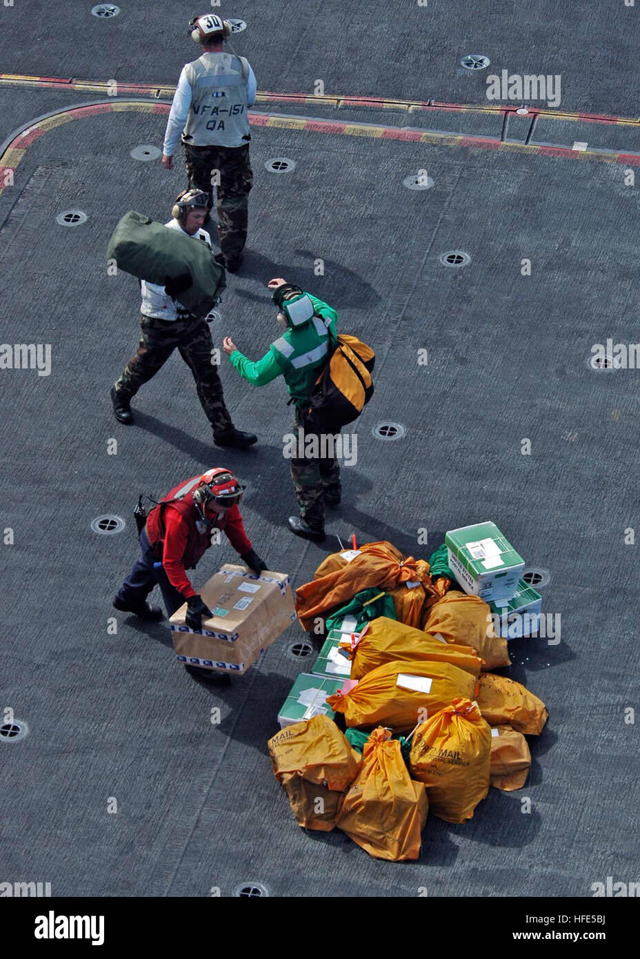 Sailors Unload Packages And Letters For Crew Aboard Uss Abraham Lincoln