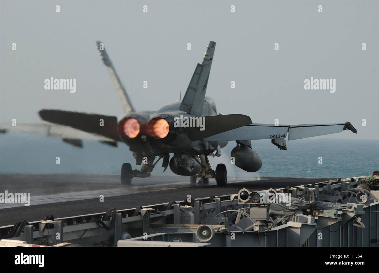 An F/A-18C Hornet from VFA-37 is launched via a steam-powered catapult ...