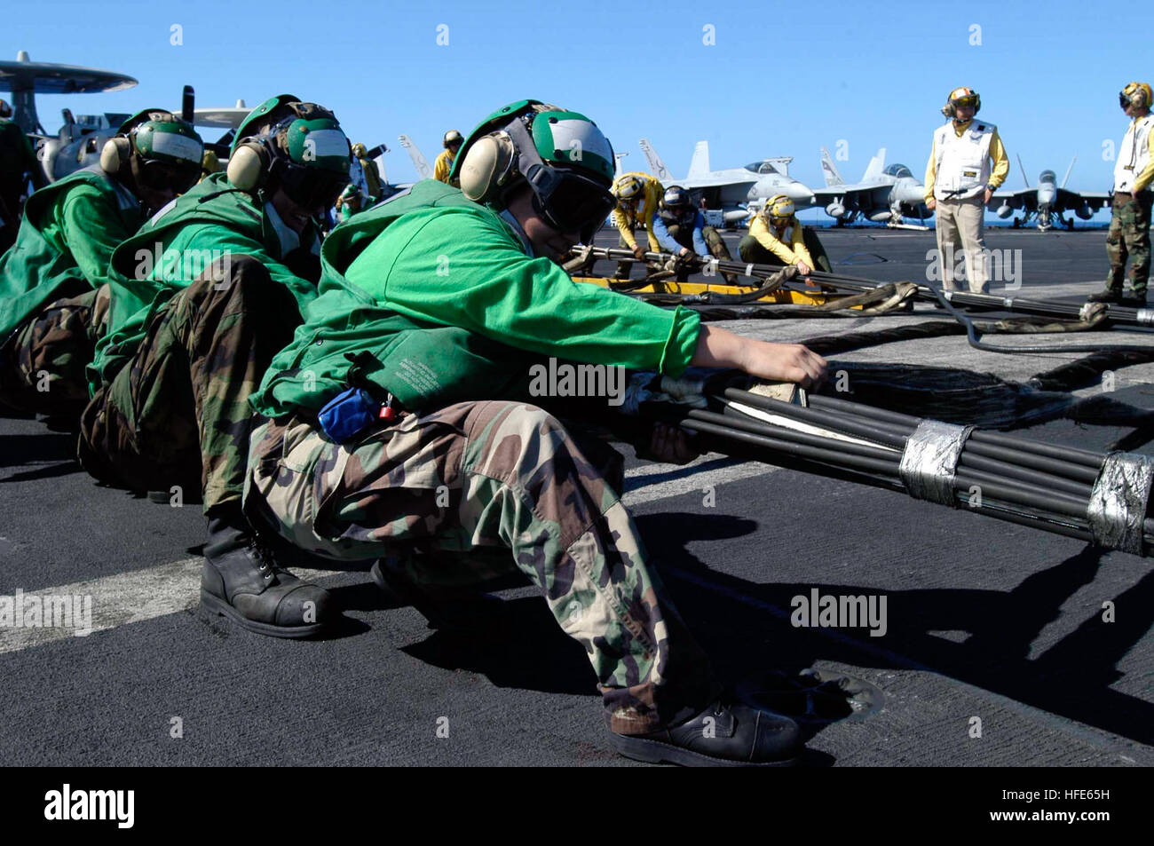 041118-N-5384B-033 Pacific Ocean (Oct. 18, 2004) - Crew members aboard ...
