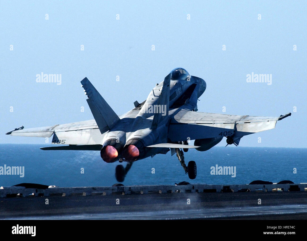 An F/A-18C Hornet from VFA-105 launches via a steam catapult aboard USS ...