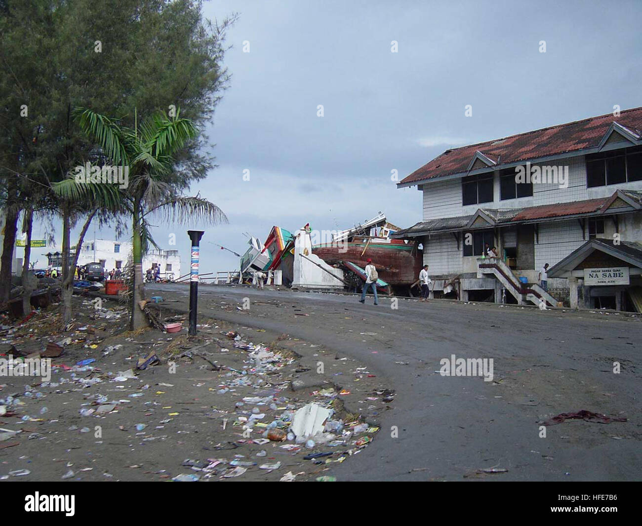 After the December 26, 2004 tsunami, boats were washed ashore near ...