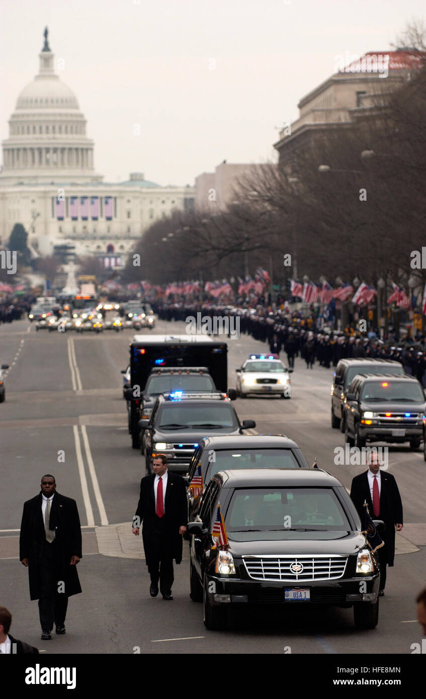 Flanked by Secret Service agents, President George W. Bush and first ...