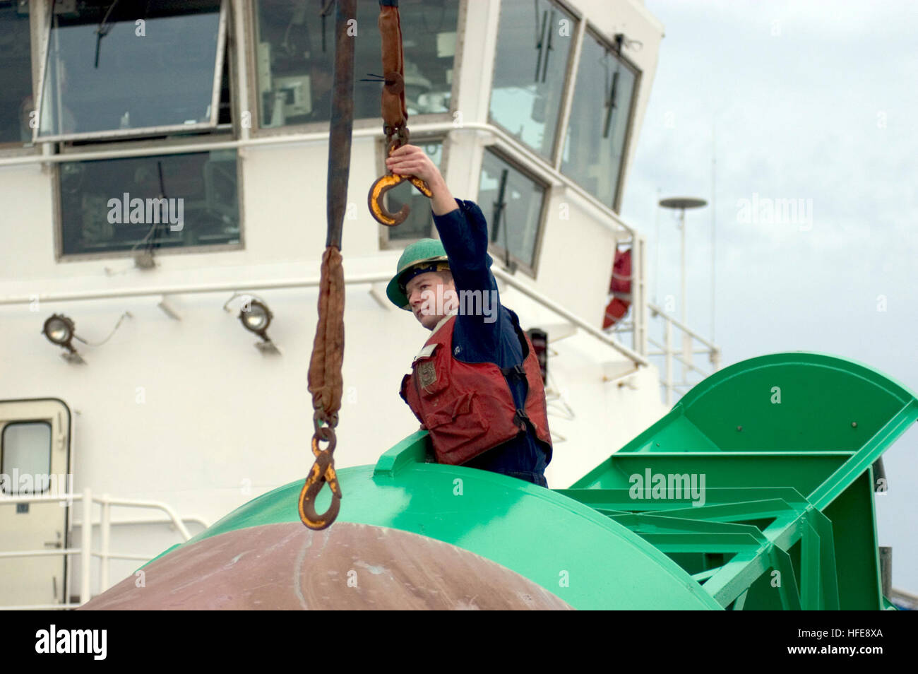 Seaman Apprentice secures a lighted buoy aboard Coast Guard Keeper ...