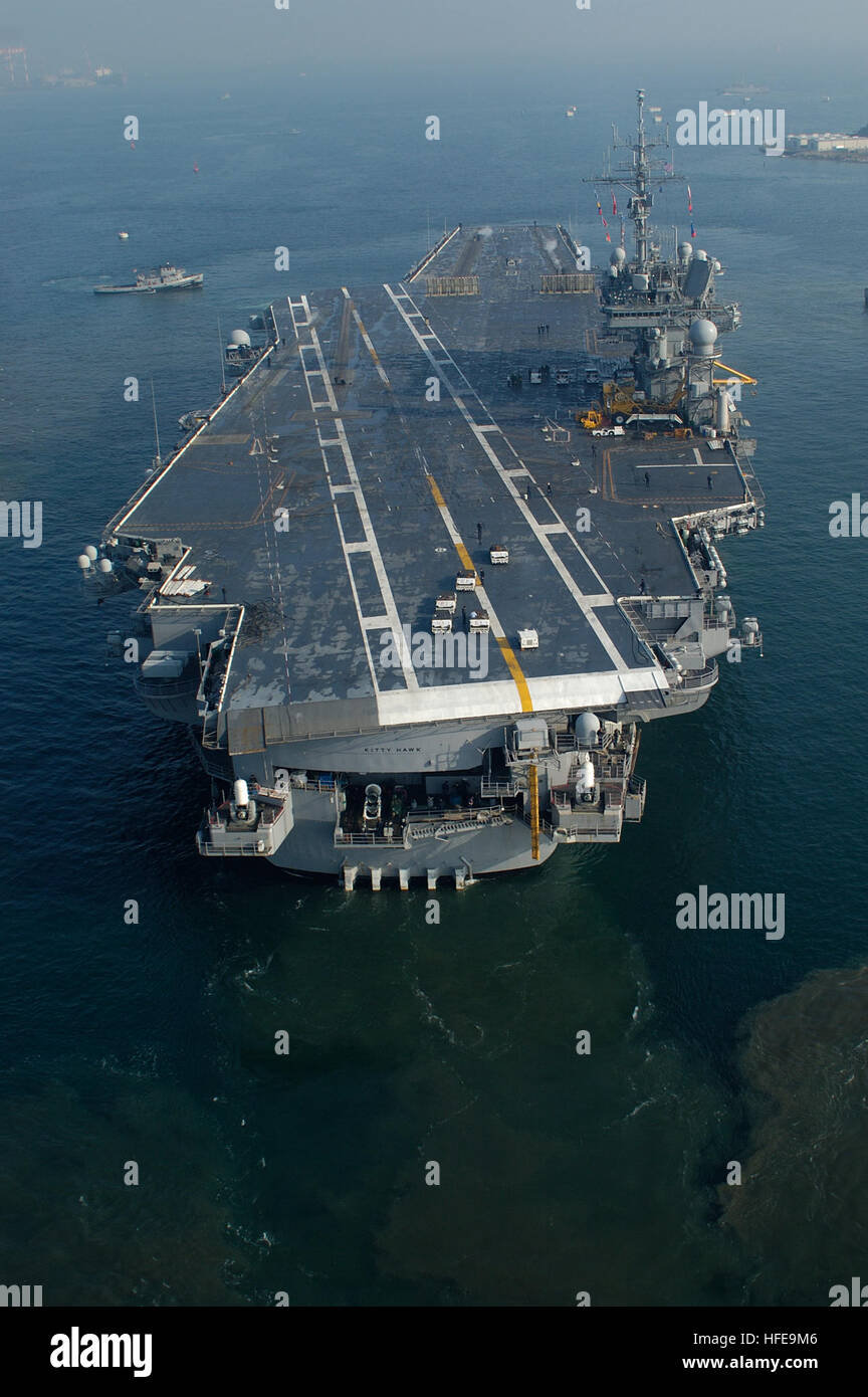 Conventionally powered aircraft carrier USS Kitty Hawk (CV 63) departs ...
