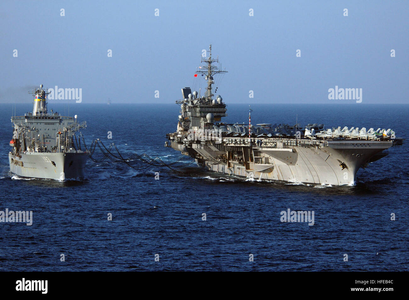 USS Kitty Hawk (CV 63) conducts underway replenishment with MSC oiler ...