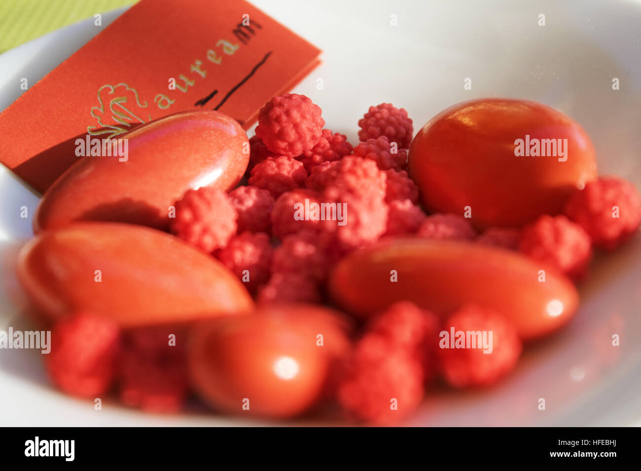 red sugared almond for degree party Stock Photo - Alamy