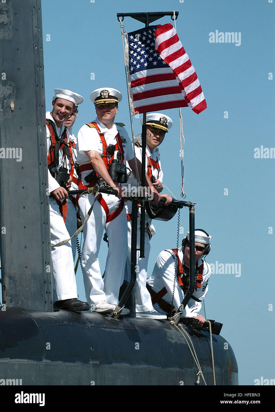 Crew members aboard USS Asheville man the conning tower while entering ...