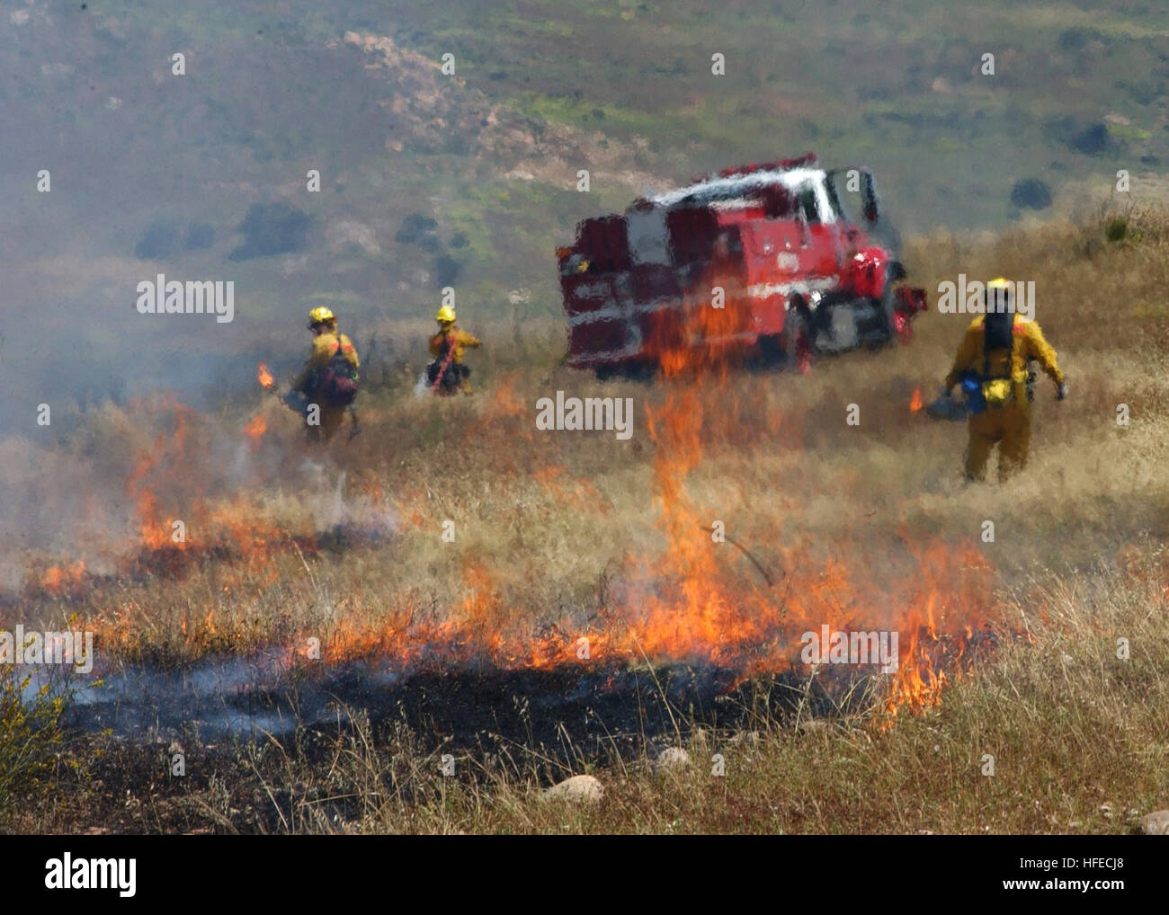 040530-N-9500T-218 San Diego, Calif. (April 30, 2005) - Firefighters ...
