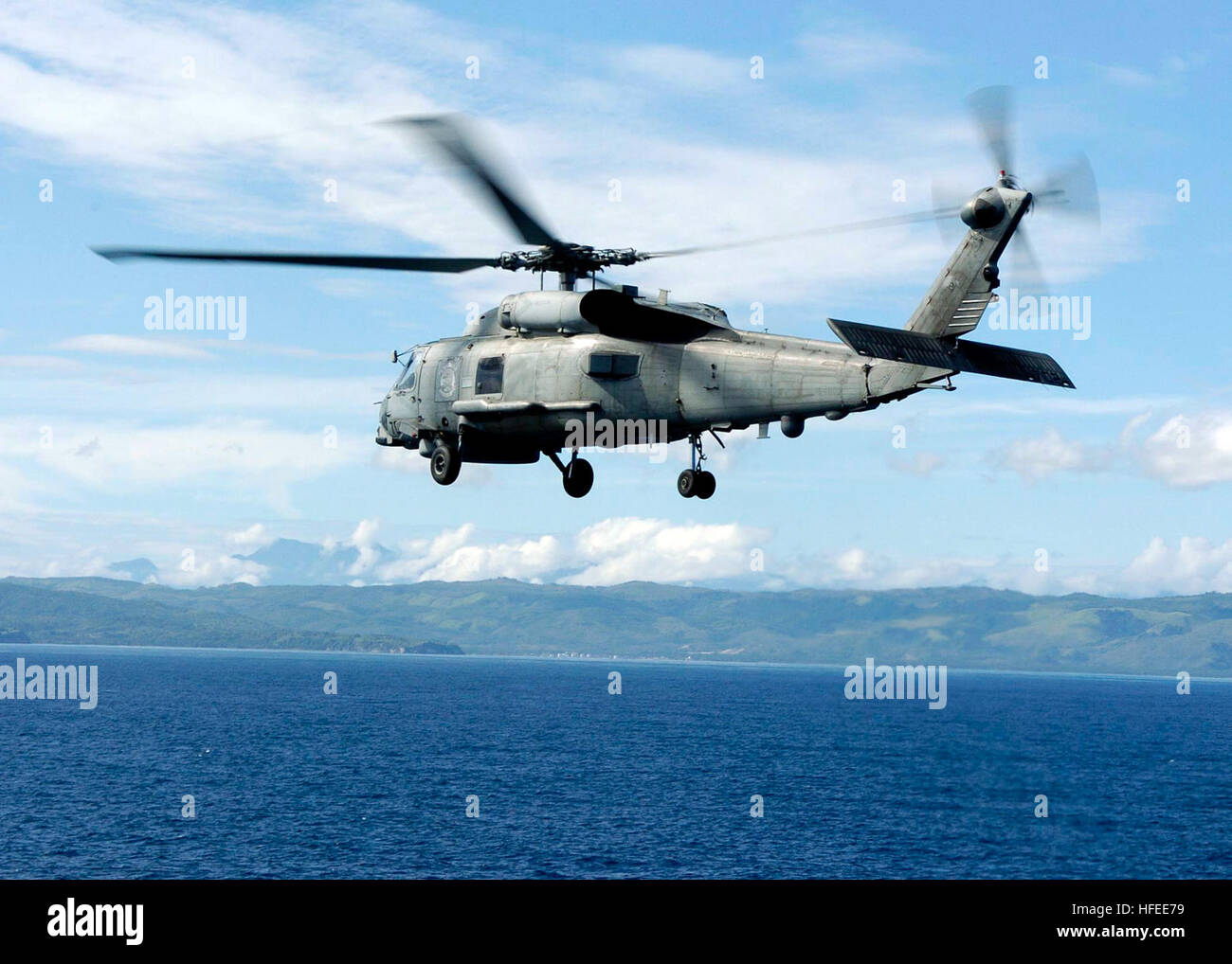 An SH-60B Seahawk from HSL-47 'Saberhawks' takes off from USS Abraham ...