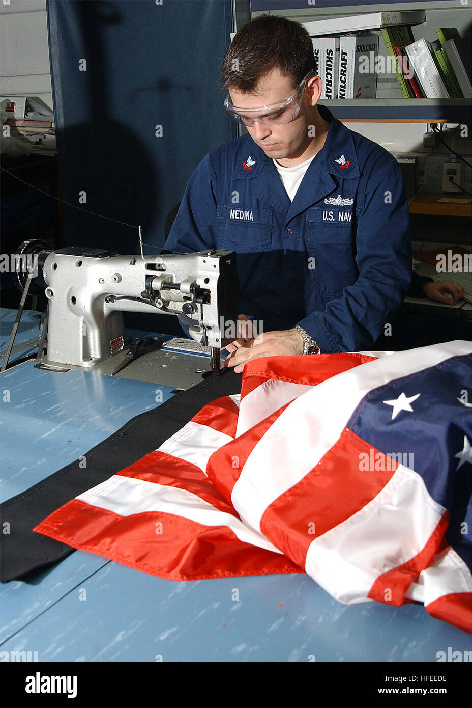 USS George Washington (CVN 73) crew mend the American flag aboard the ...
