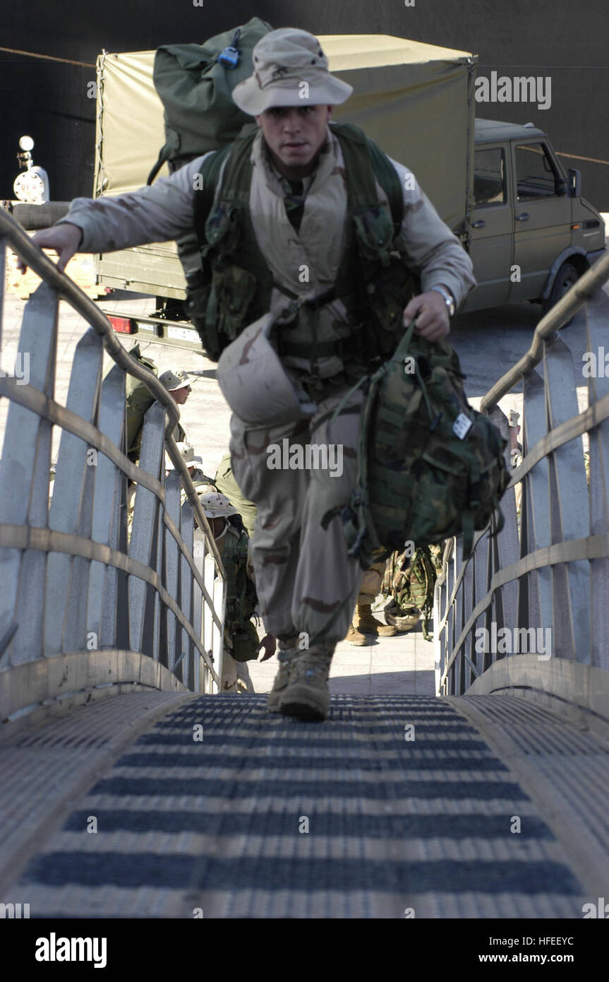 A U.S. Marine boards the Marine Prepositioning Squadron ship 2nd Lt ...