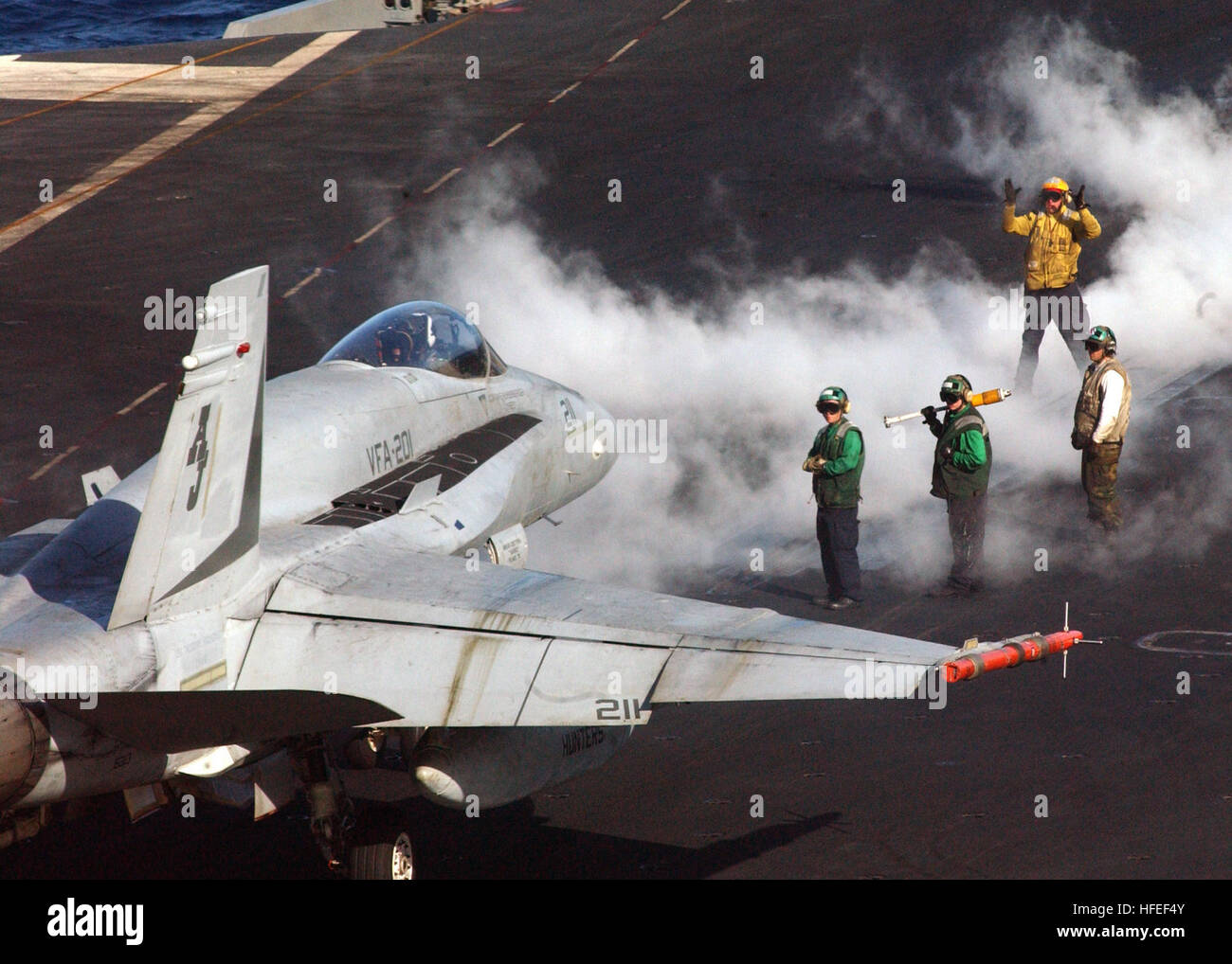 An F/A-18C Hornet of VFA-201 'Hunters' approaches a steam catapult on ...