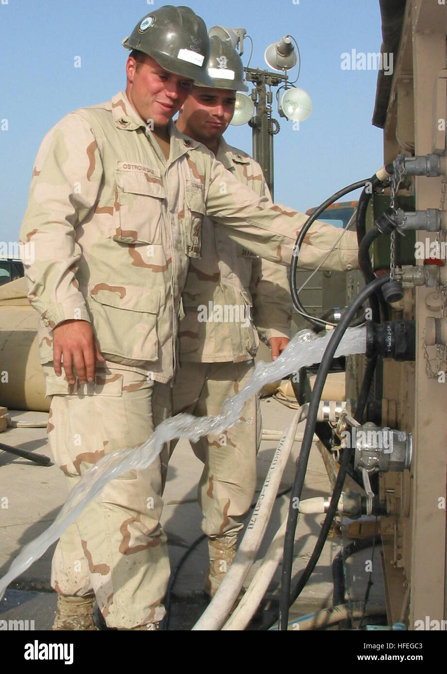 030310-N-1050K-016 Camp Patriot, Kuwait -- From left, Utilitiesman 2nd ...
