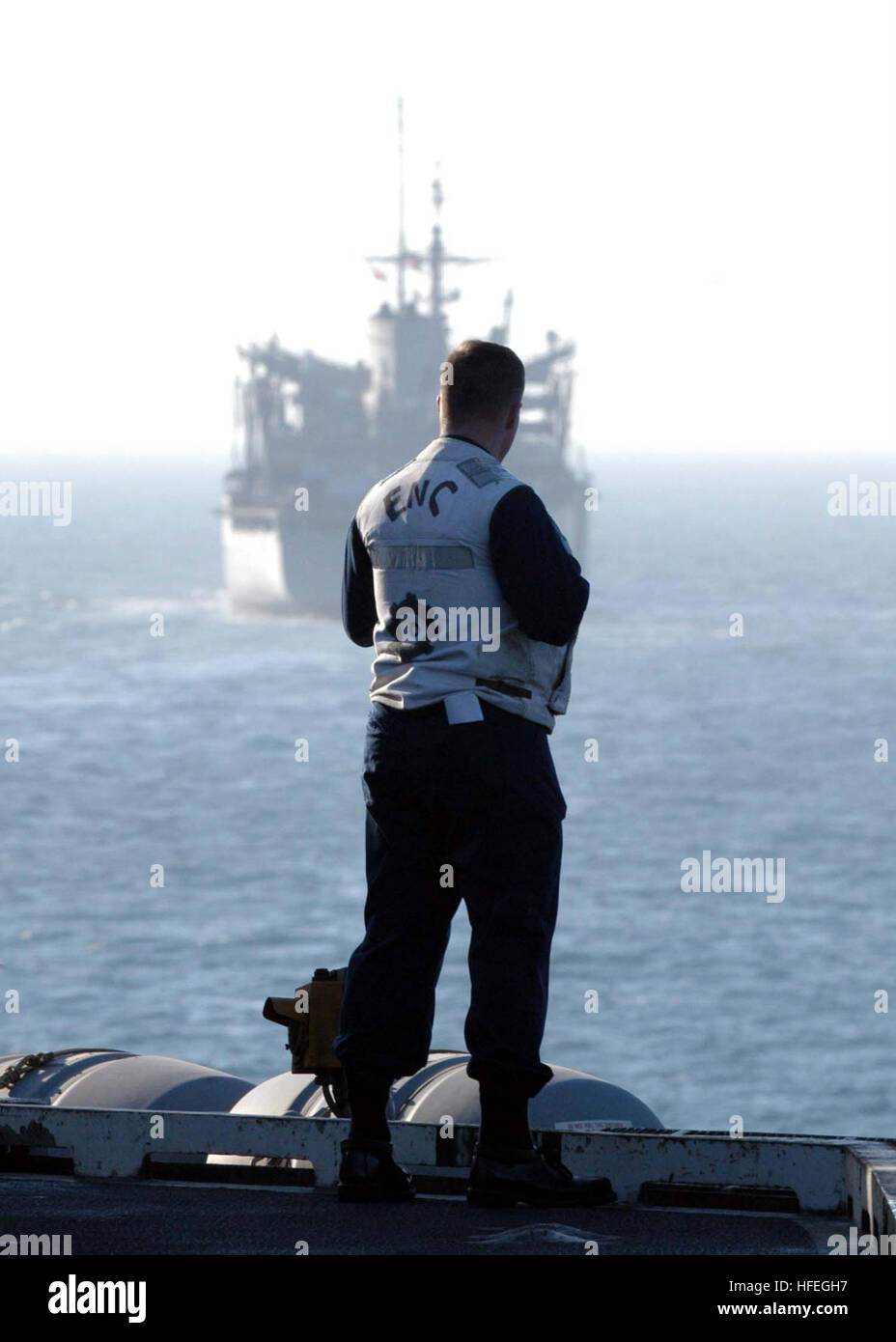 A Chief Engineman stands on the flight deck of USS Abraham Lincoln (CVN ...