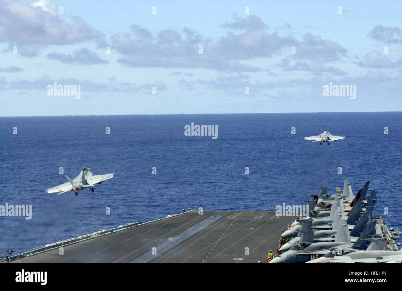Two F/A-18E Super Hornets of Strike Fighter Squadron 14 (VFA-14) launch ...