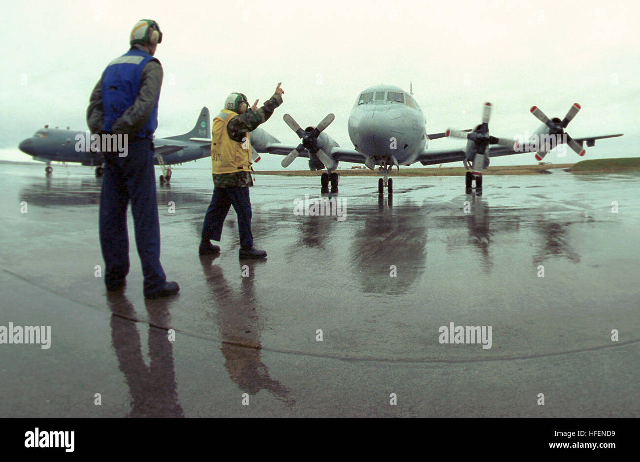 Linemen of Patrol Squadron Sixty Six (VP-66), 'Liberty Bells,' inspect ...