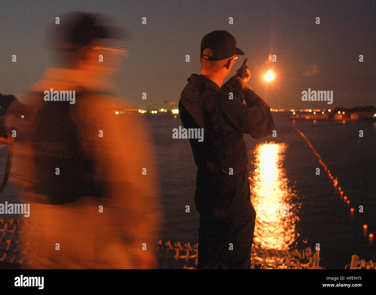 On USS Blue Ridge (LCC 19), Master-at-Arms fires a non-lethal airburst ...