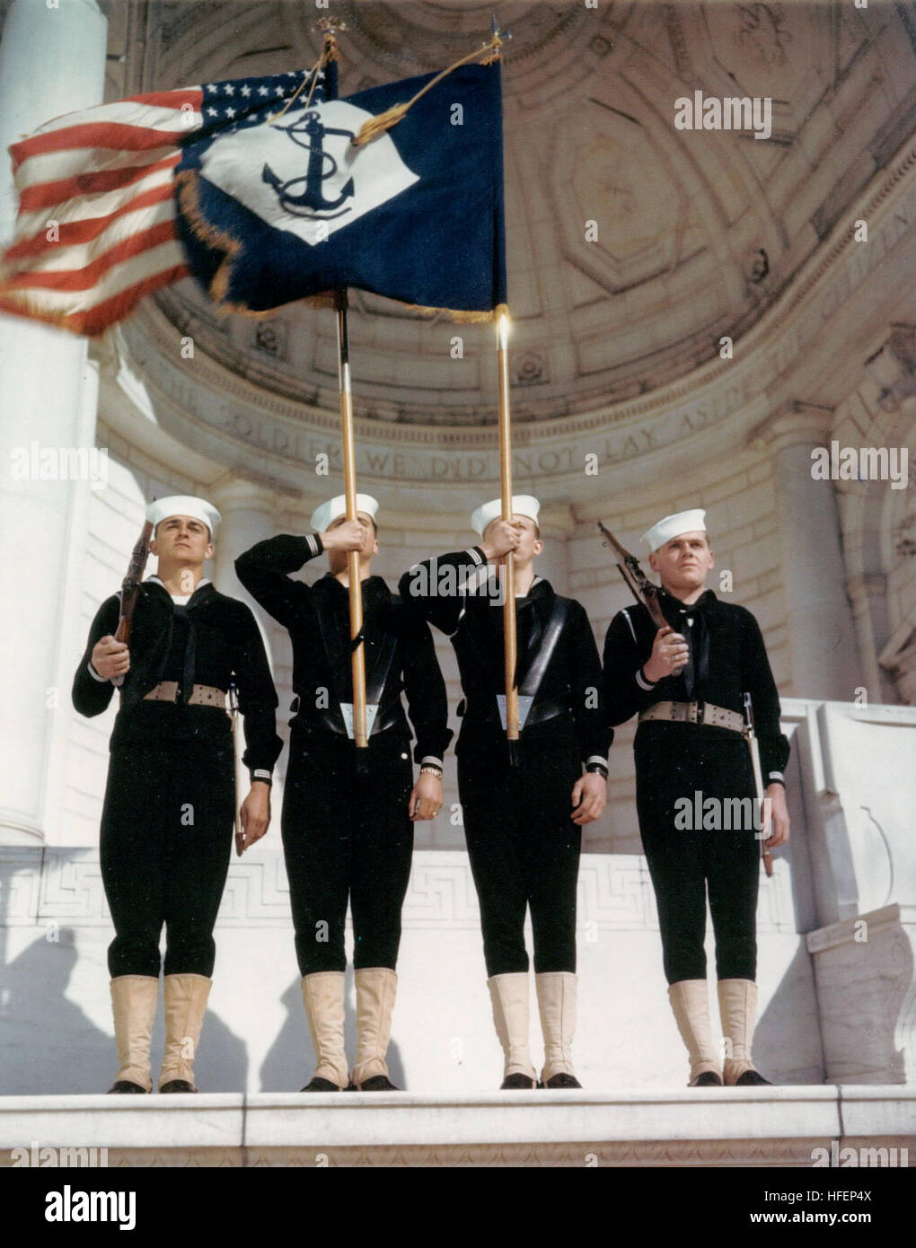 A Navy color guard parades at Arlington National Cemetery Amphitheater ...