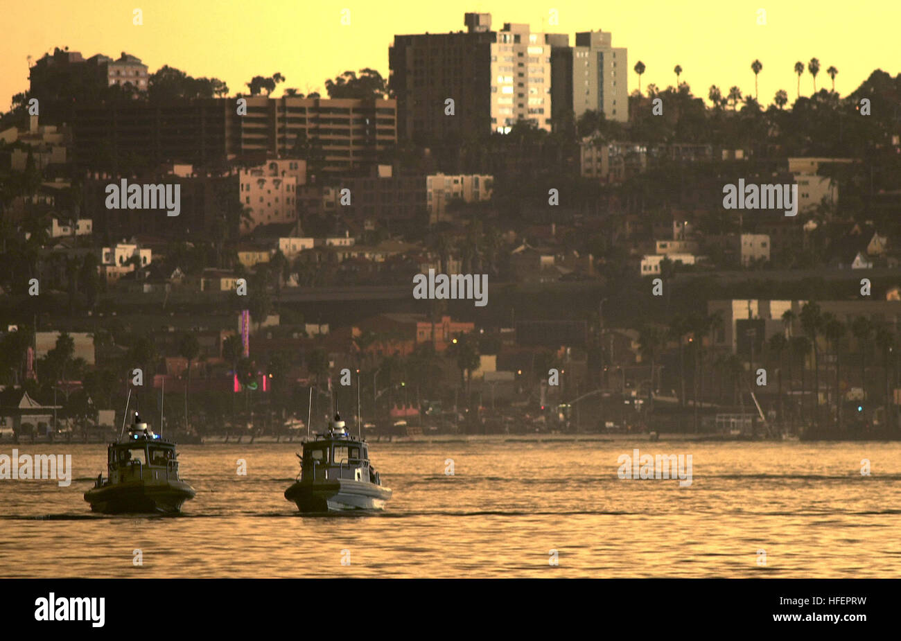 Two U.S. Navy security boats patrol waters near Naval Air Station North ...