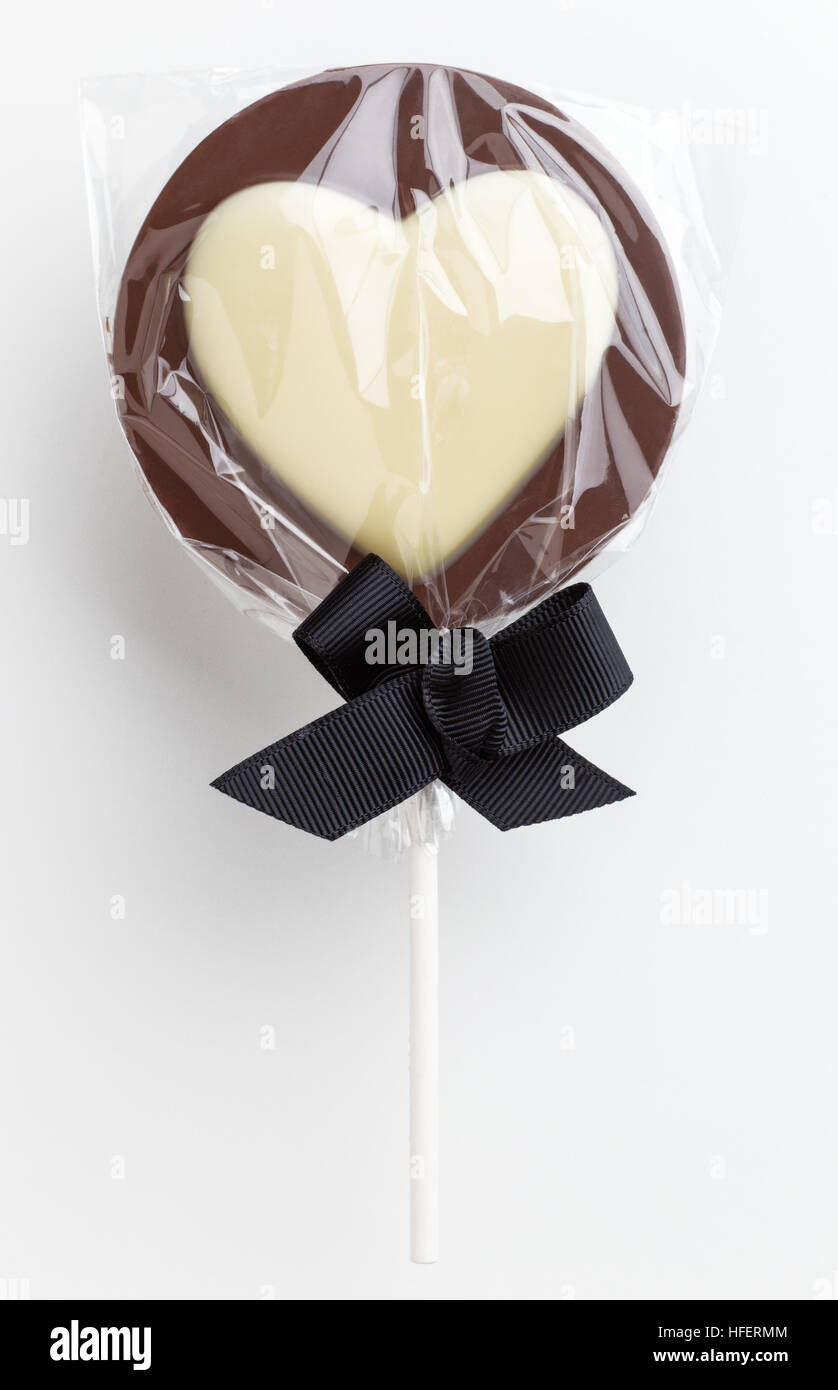 wrapped up love heart shaped chocolate lolly shot in the studio on ...