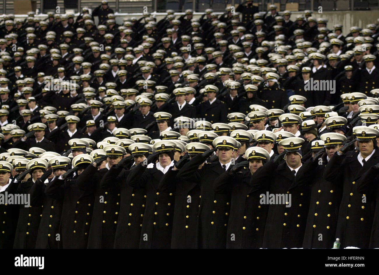 The U.S. Naval Academy Brigade of Midshipmen salutes during the ...