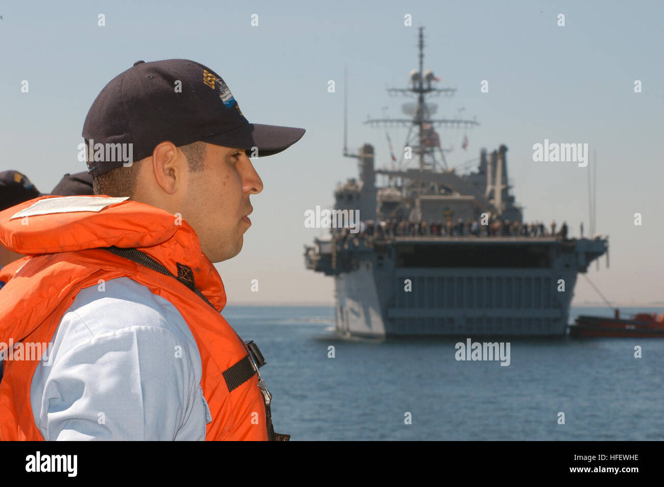 Seaman assigned to amphibious transport dock USS Duluth (LPD 6) stands ...