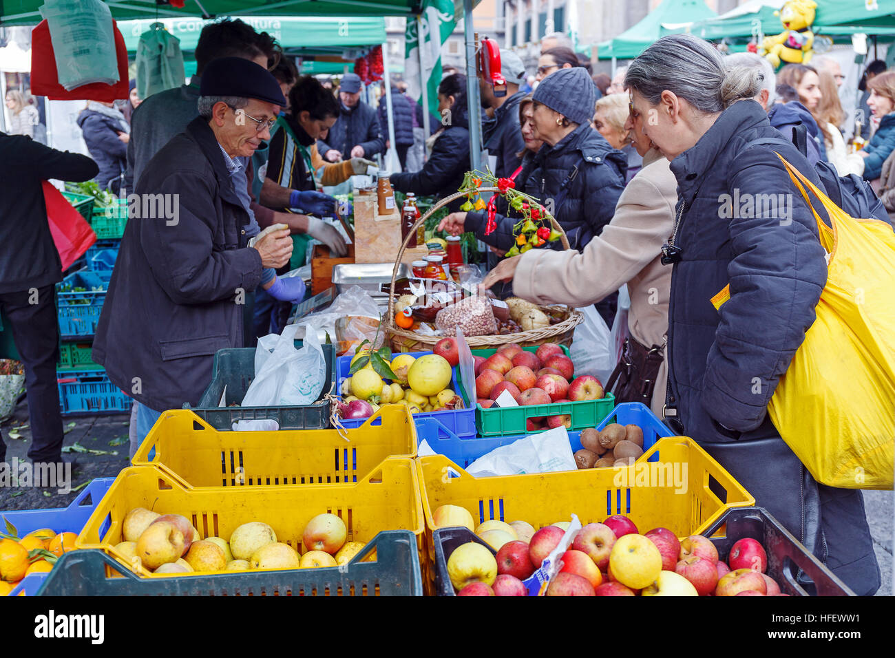 Naples, Italy - January 11, 2016: fruit counter market, people lined up ...