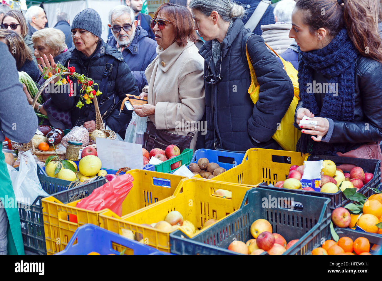 Naples, Italy - January 11, 2016: fruit counter market, people lined up ...