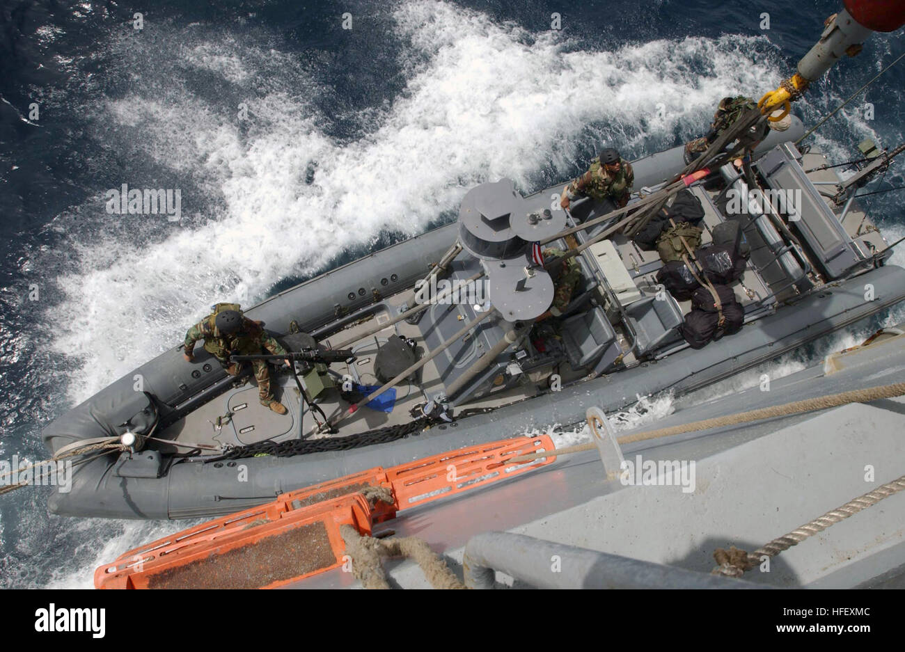 Rigid hull inflatable boat lowered from hi-res stock photography and ...