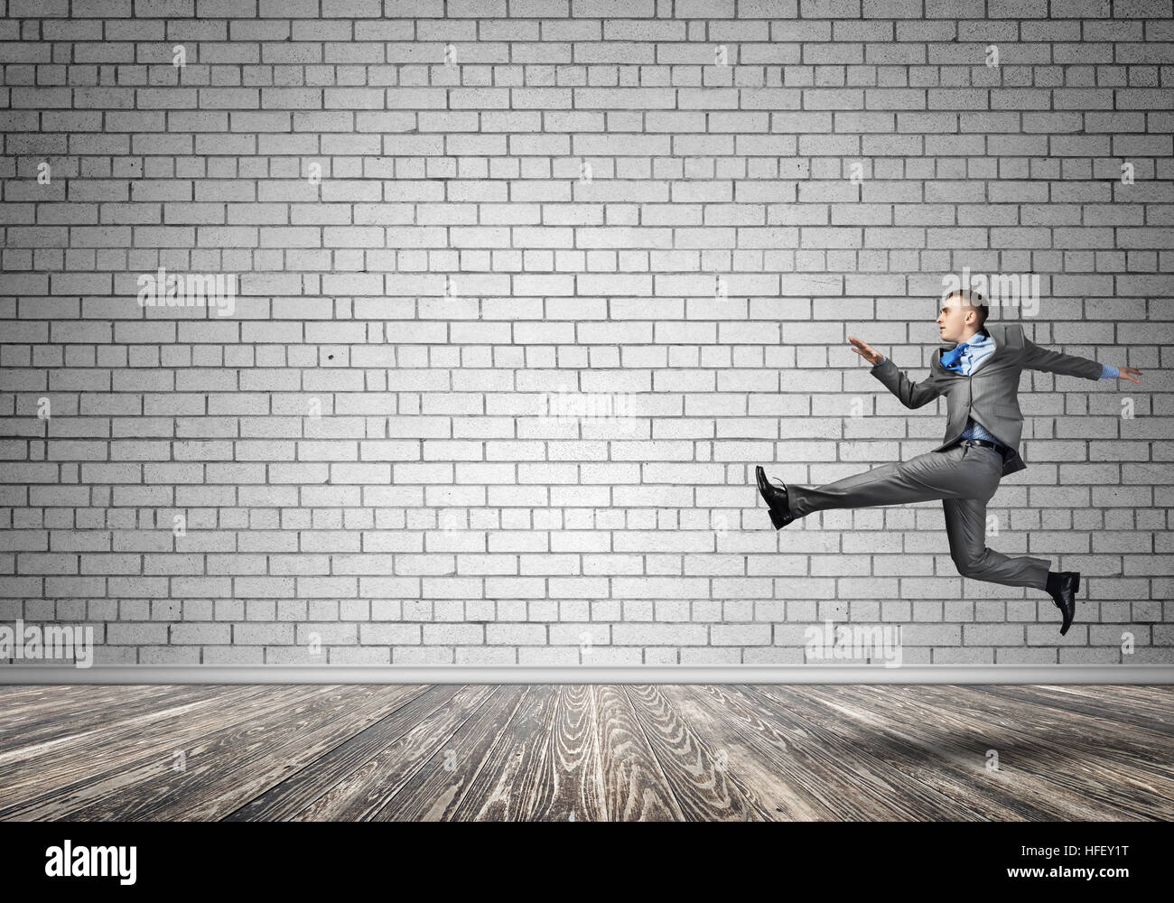 Businessman jumping high Stock Photo - Alamy