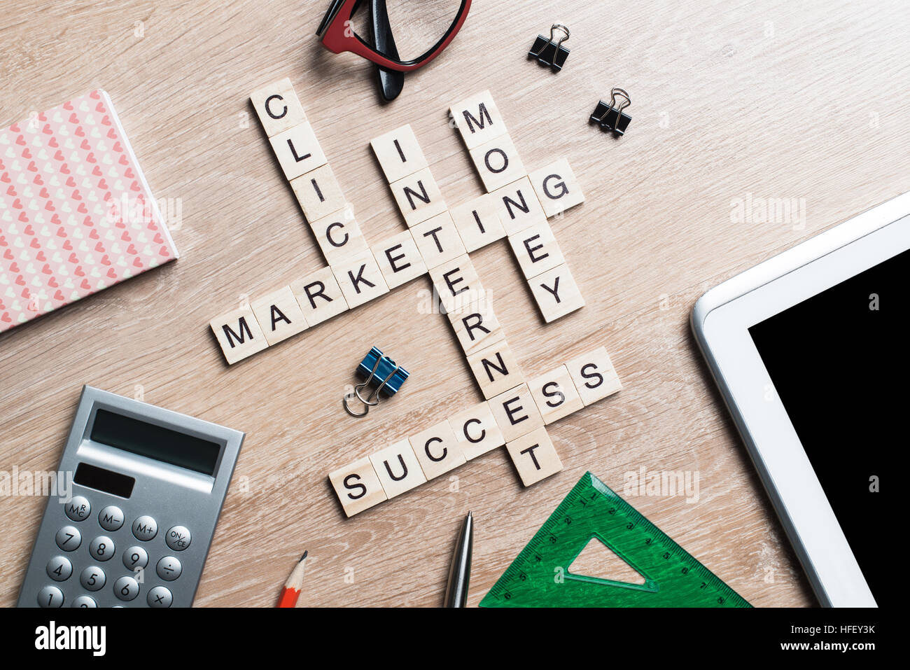 Conceptual business keywords on table with elements of game making ...