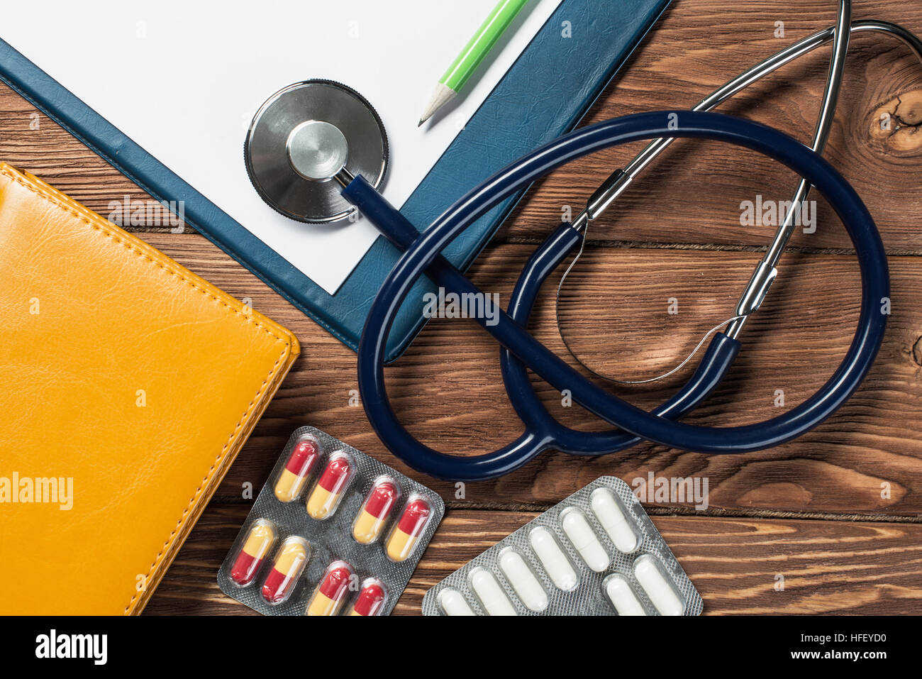 Desk of doctor with medicine things Stock Photo - Alamy