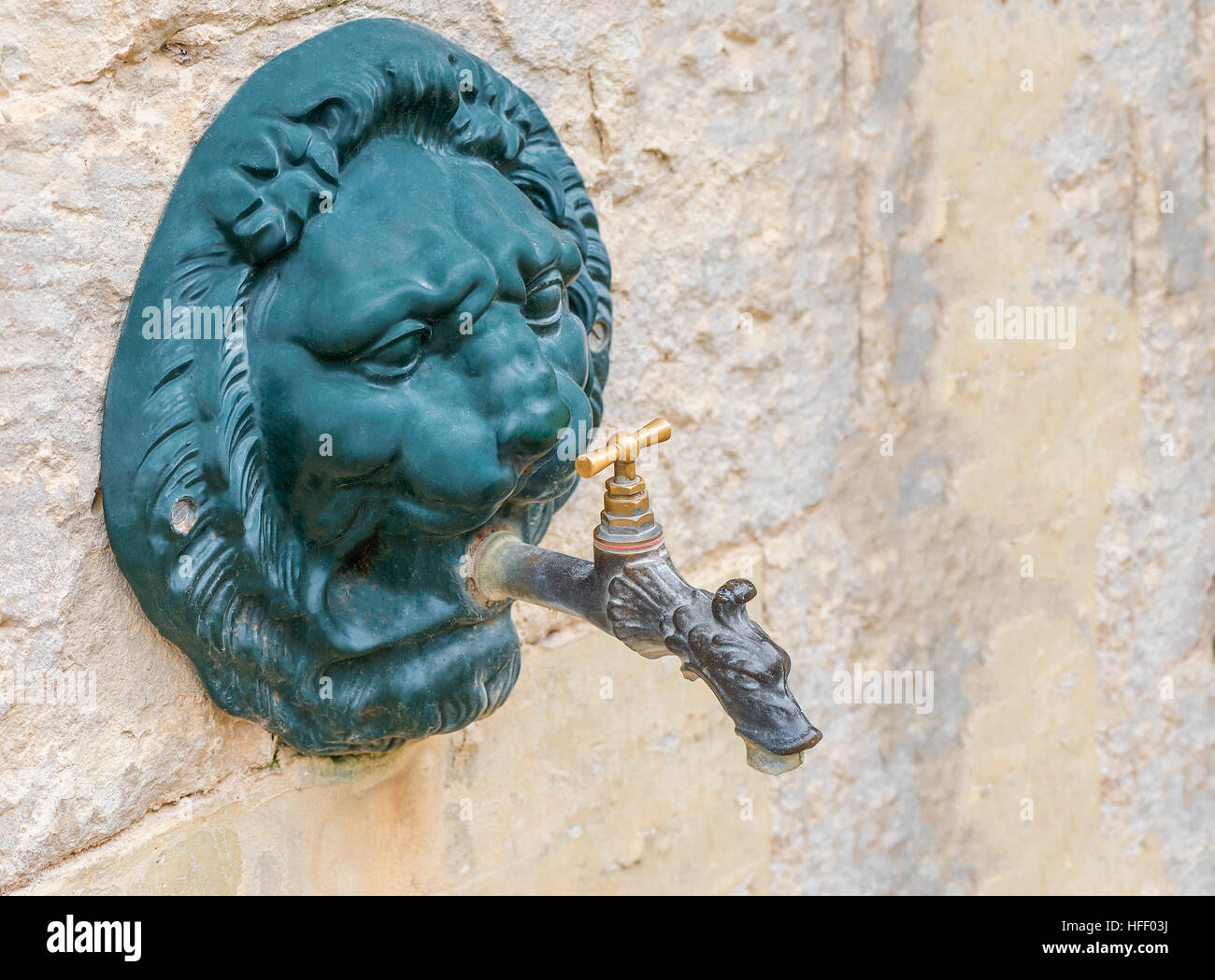 Artistic street water tap Stock Photo - Alamy