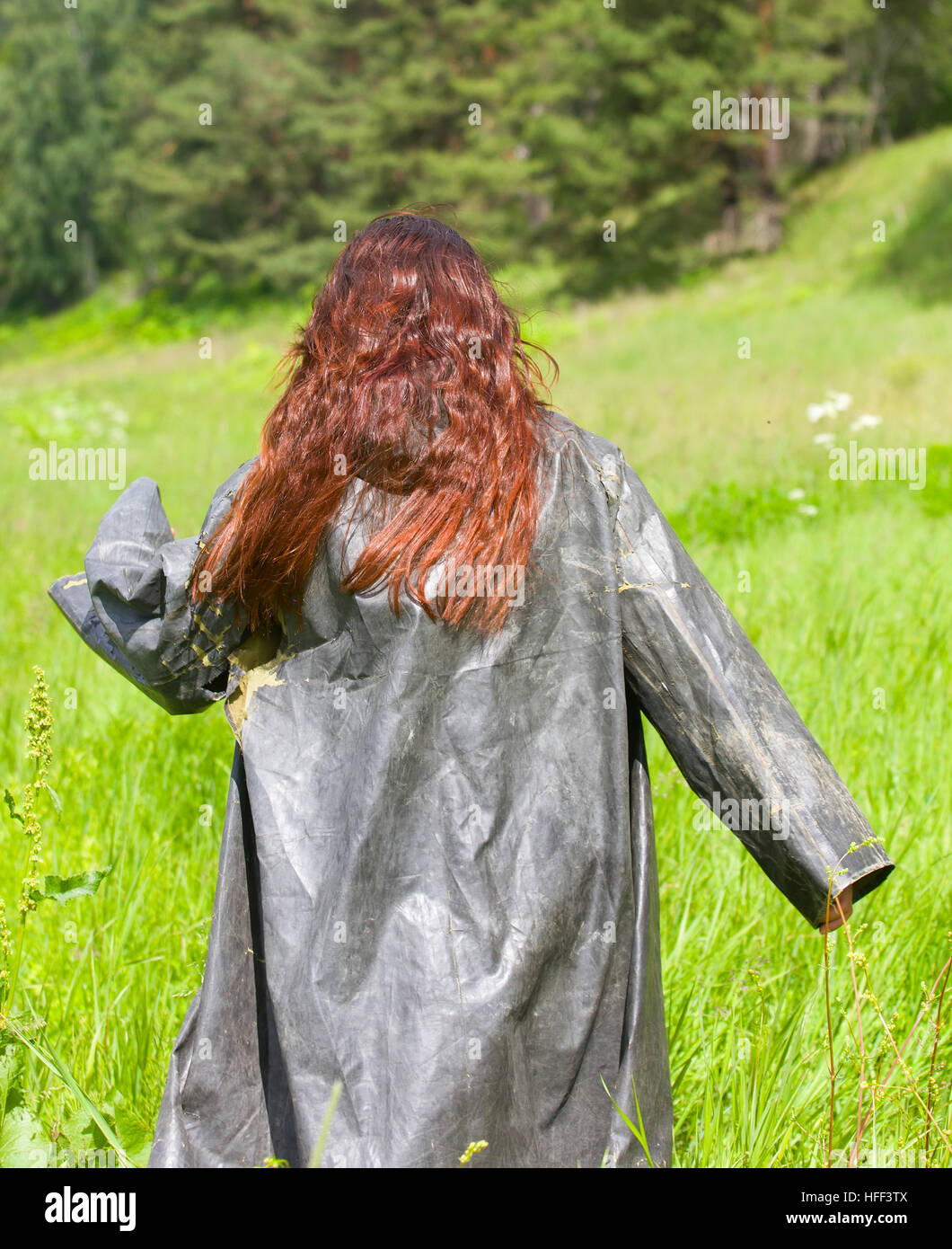 old ragged clothes. girl in a vintage coat chemical protection used in ...