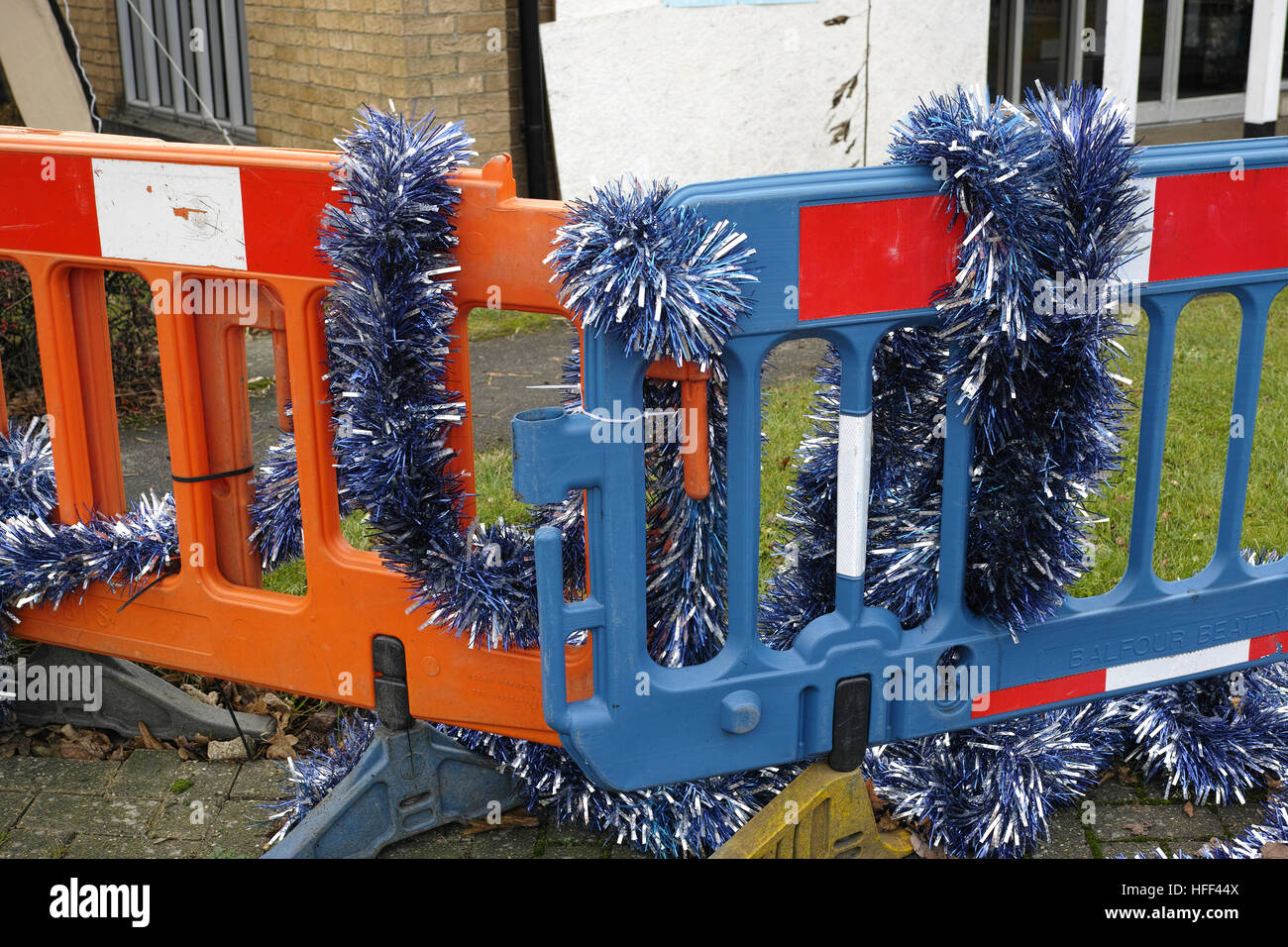 Plastic Barriers decorated with Christmas Tinsel Stock Photo - Alamy