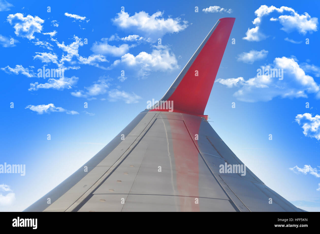 Airplane wing over the blue sky Stock Photo - Alamy