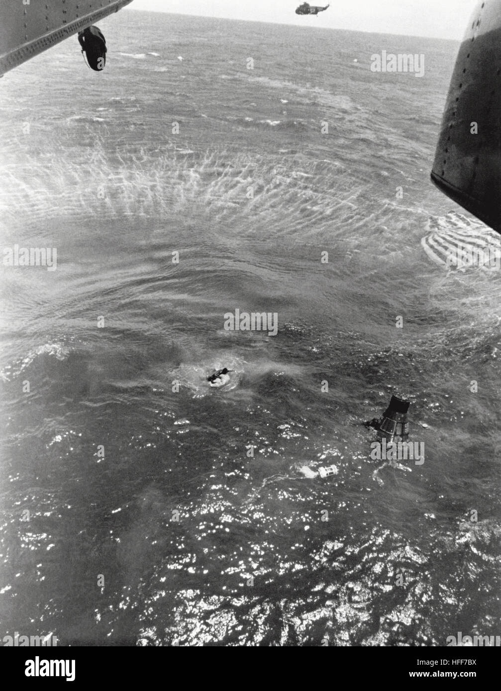 U.S. Navy frogmen prepare for the recovery of the Gemini 4 spacecraft ...