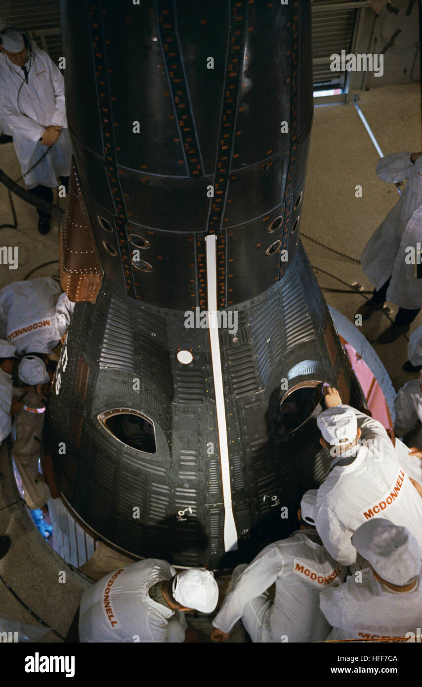 The Gemini 3 spacecraft undergoes final inspection before its historic ...