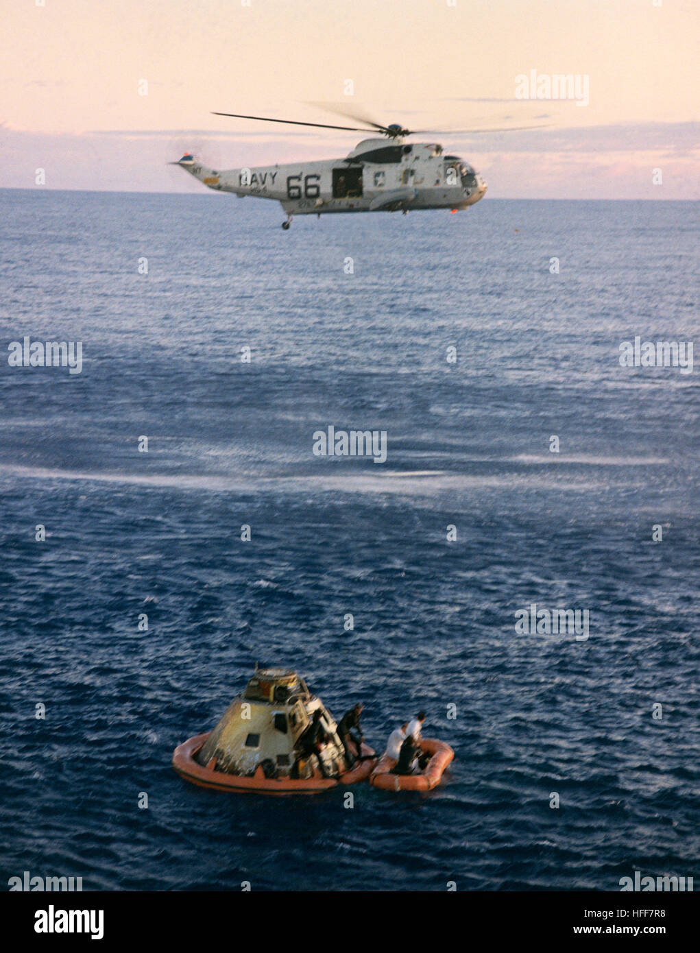 An SH-3D helicopter from HS-4 hovers over the Apollo 10 command module ...
