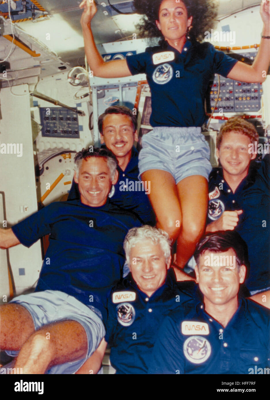 The crew of the STS-41-D mission is seen enjoying their time in space ...
