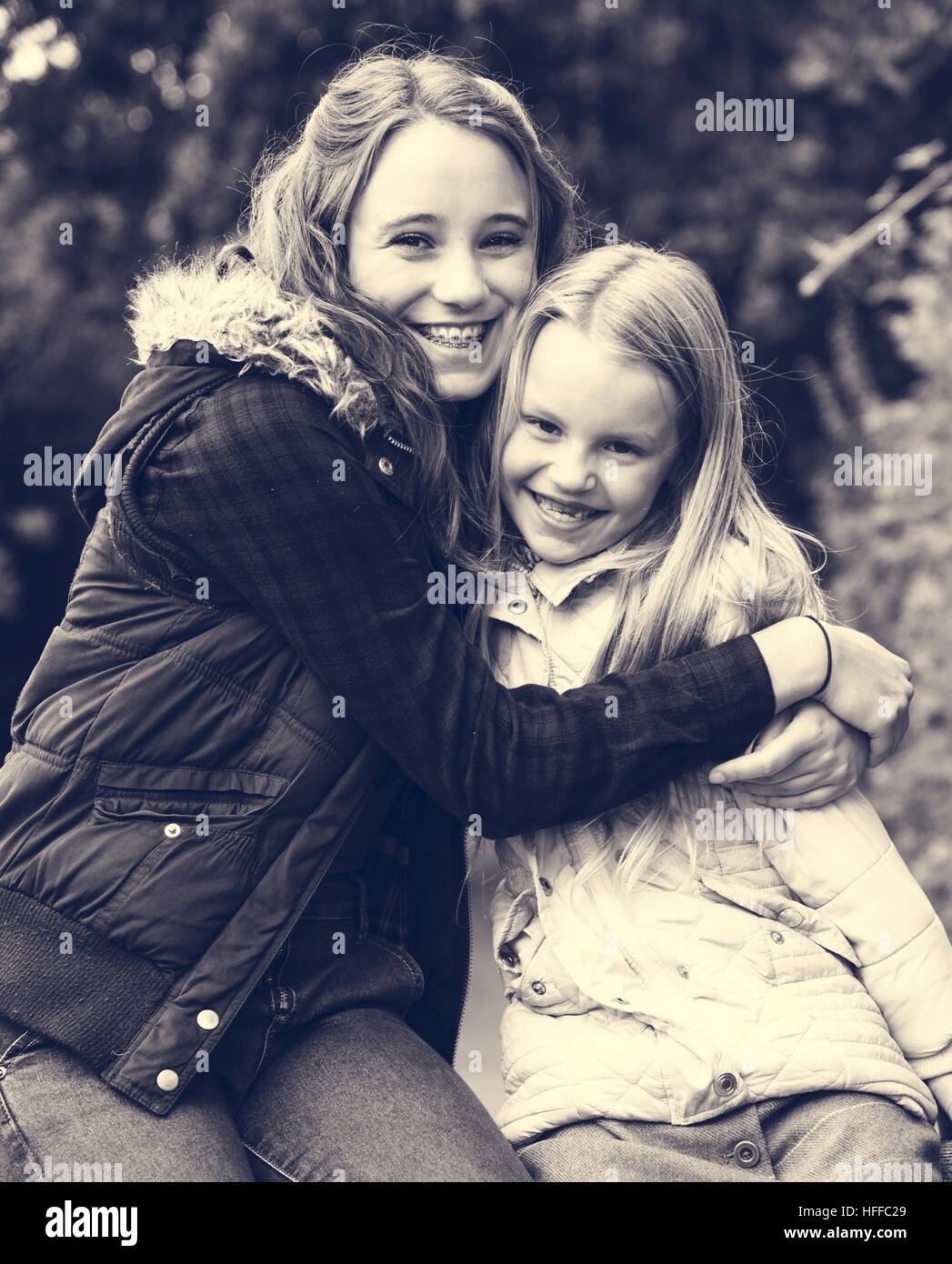 Sister Hug Togetherness Outdoors Girls Concept Stock Photo - Alamy