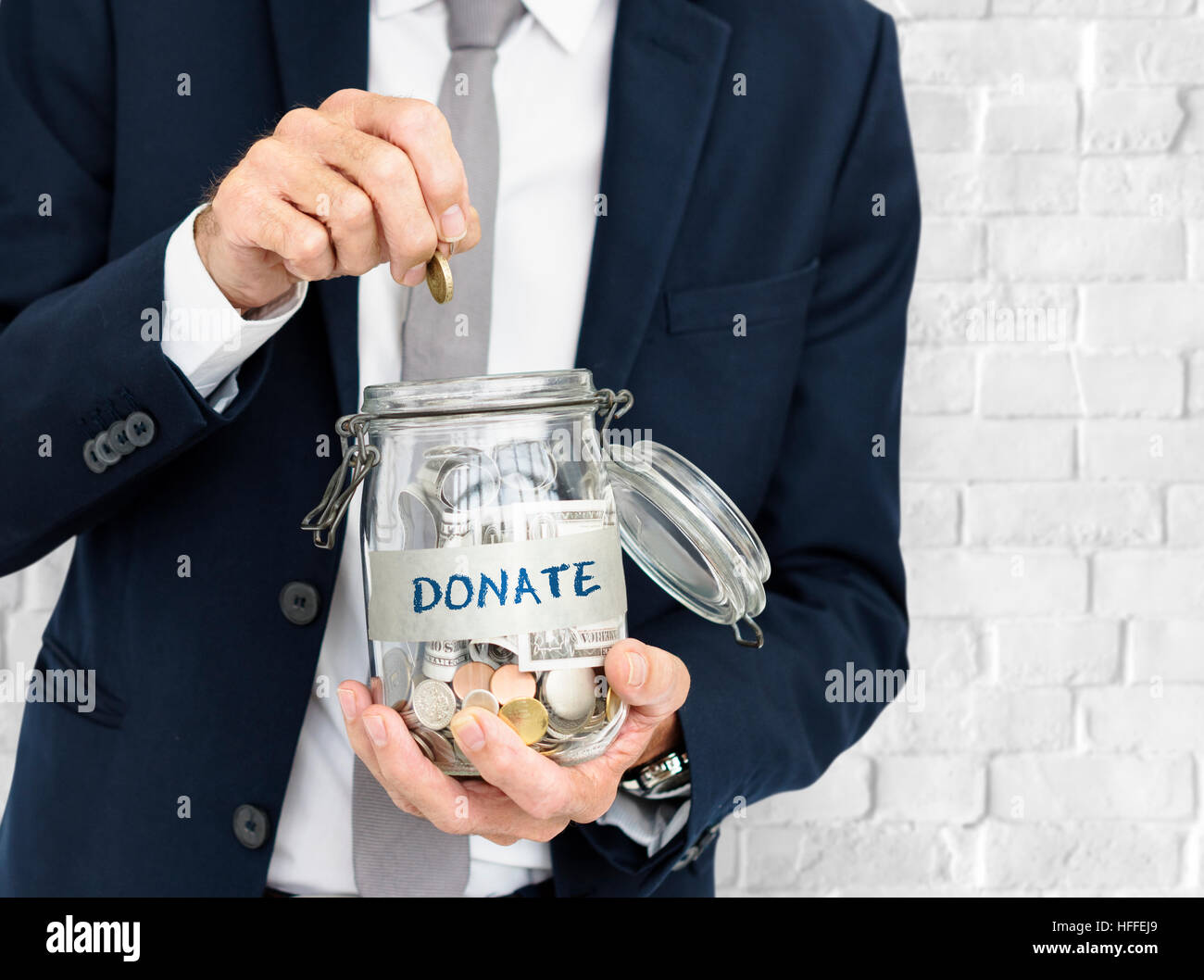 Businessman GIving Money Donation Charity Concept Stock Photo - Alamy