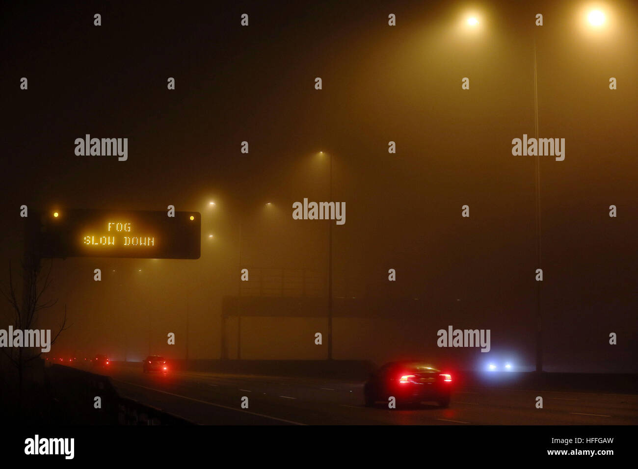 A sign on the M25 motorway near Heathrow Airport warns motorists of fog ...