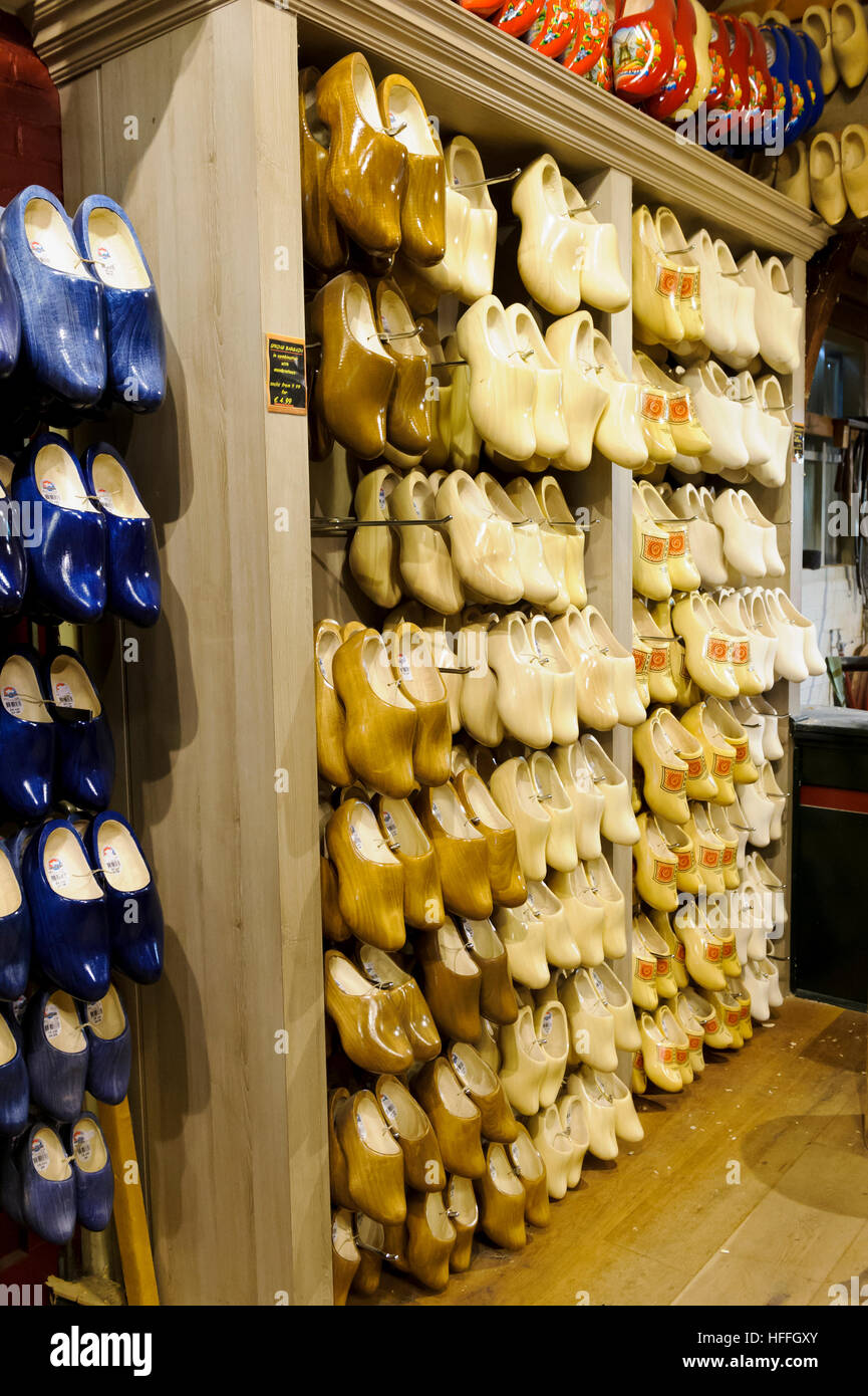 Wooden clogs on shoe racks on display in a shop in Amsterdam, Holland ...