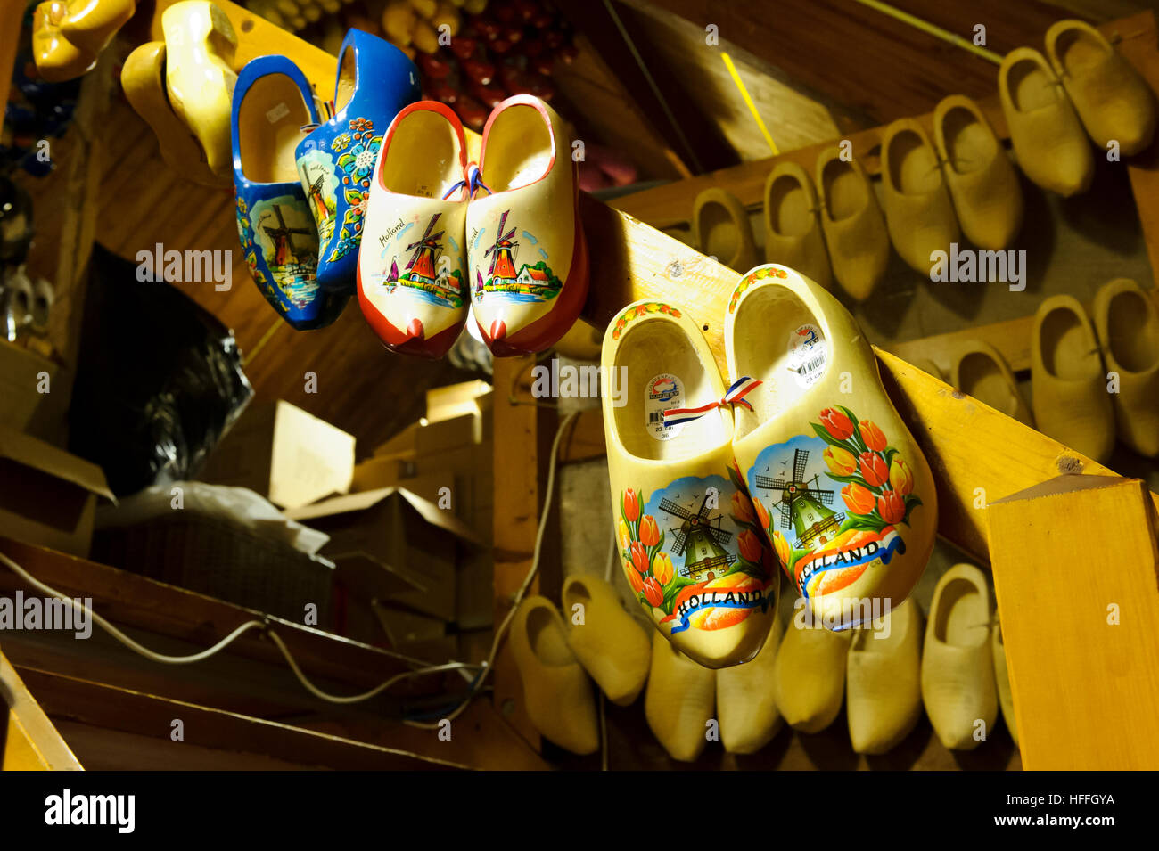 Colourful and decorative clogs on display on wooden frame in a shop in ...