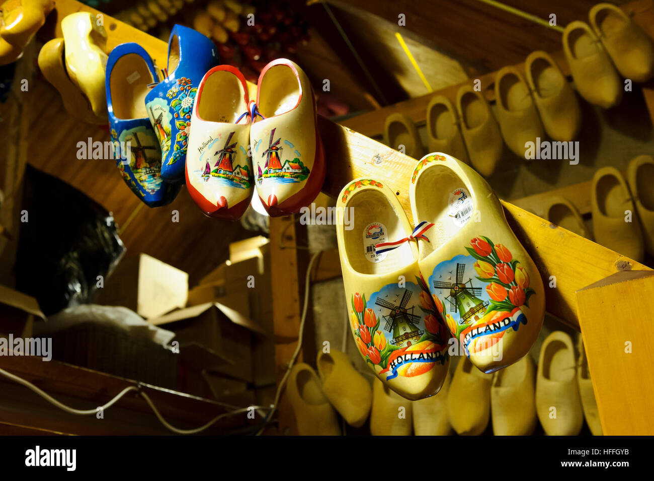 Colourful and decorative clogs on display on wooden frame in a shop in ...